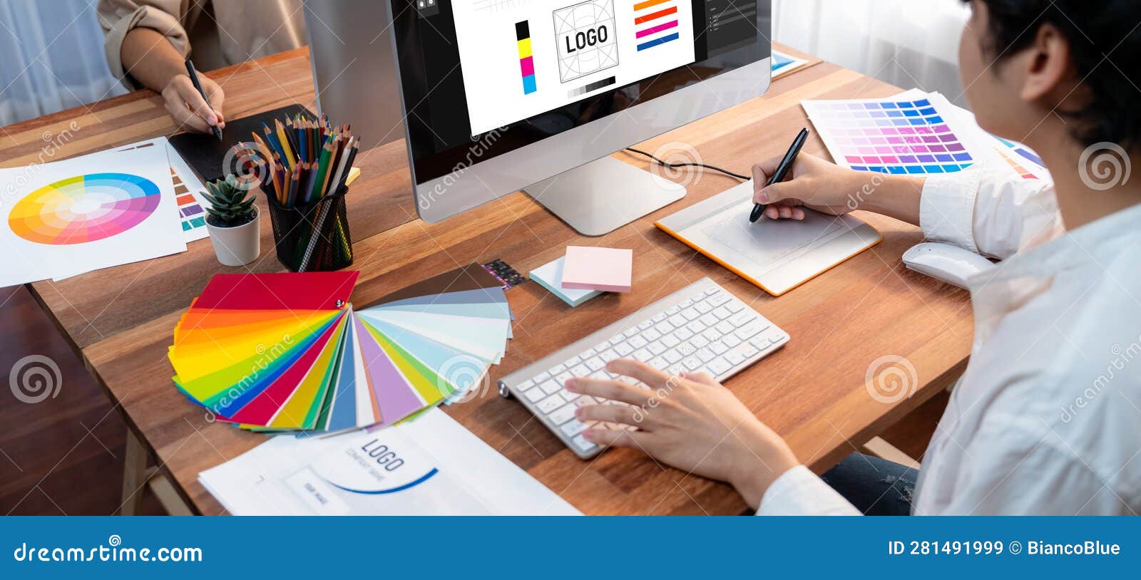 Graphic Designer Works on Computer Laptop with Digital Pen. Scrutinize ...