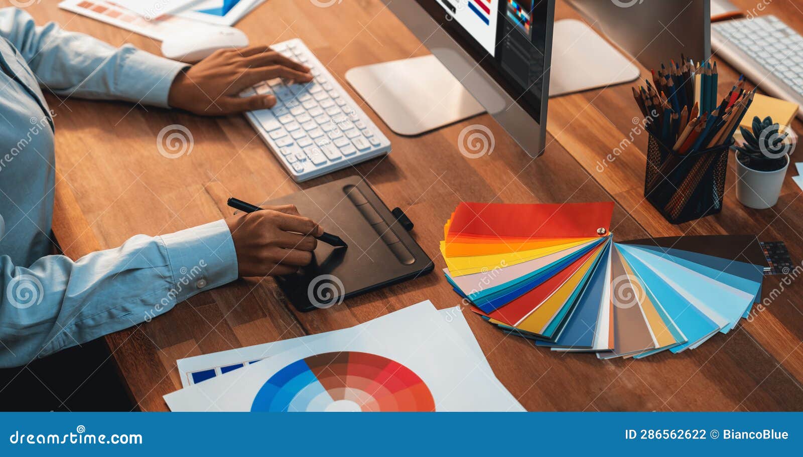 Graphic Designer Works on Computer Laptop with Digital Pen. Scrutinize ...