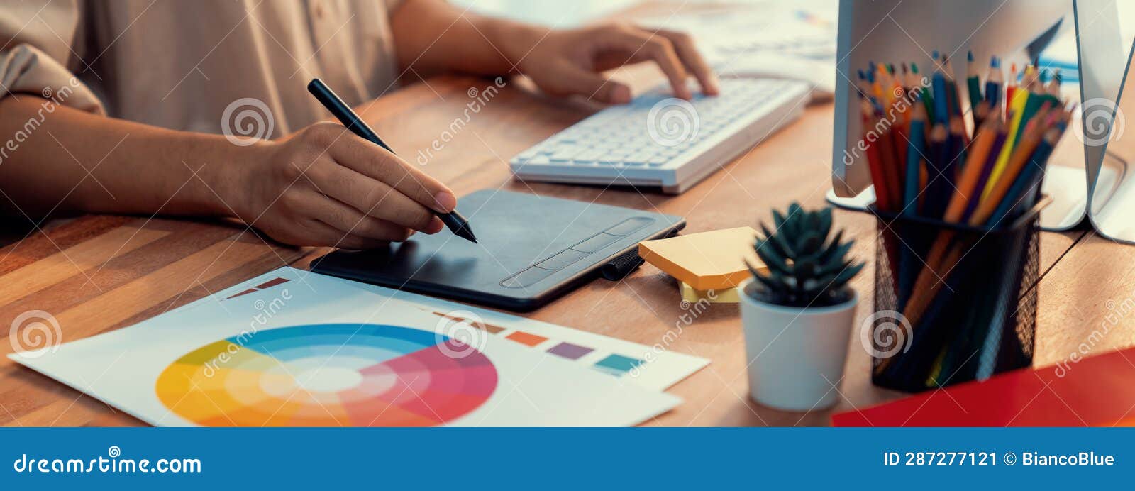 Graphic Designer Works on Computer Laptop with Digital Pen. Scrutinize ...