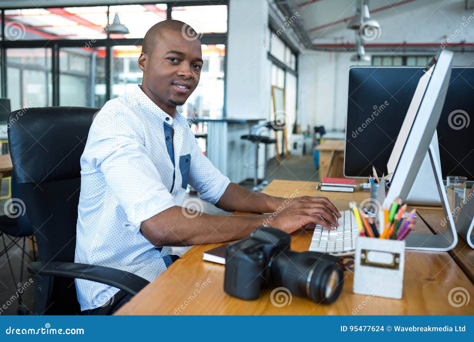 Graphic Designer Working at Desk Stock Photo - Image of happy, artist ...