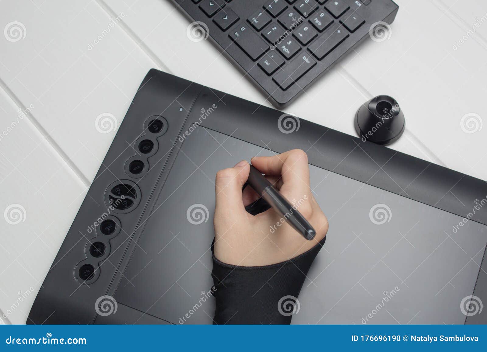 Graphic Designer Working on Digital Tablet. the Hand Draws on a ...