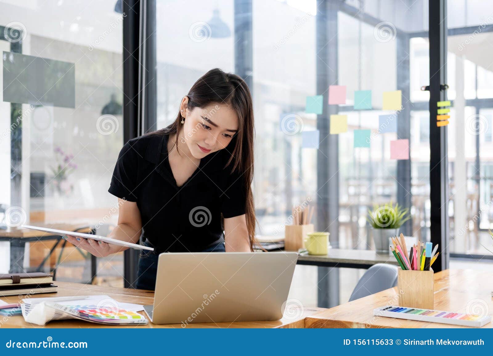 Graphic Designer Working at Her Desk in Creative Studio Office Stock ...