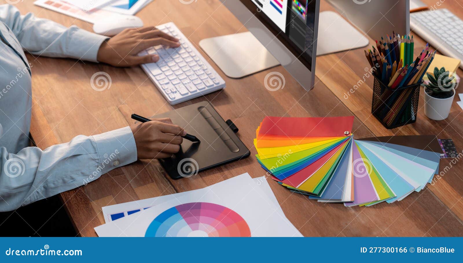 Graphic Designer Works on Computer Laptop with Digital Pen. Scrutinize ...