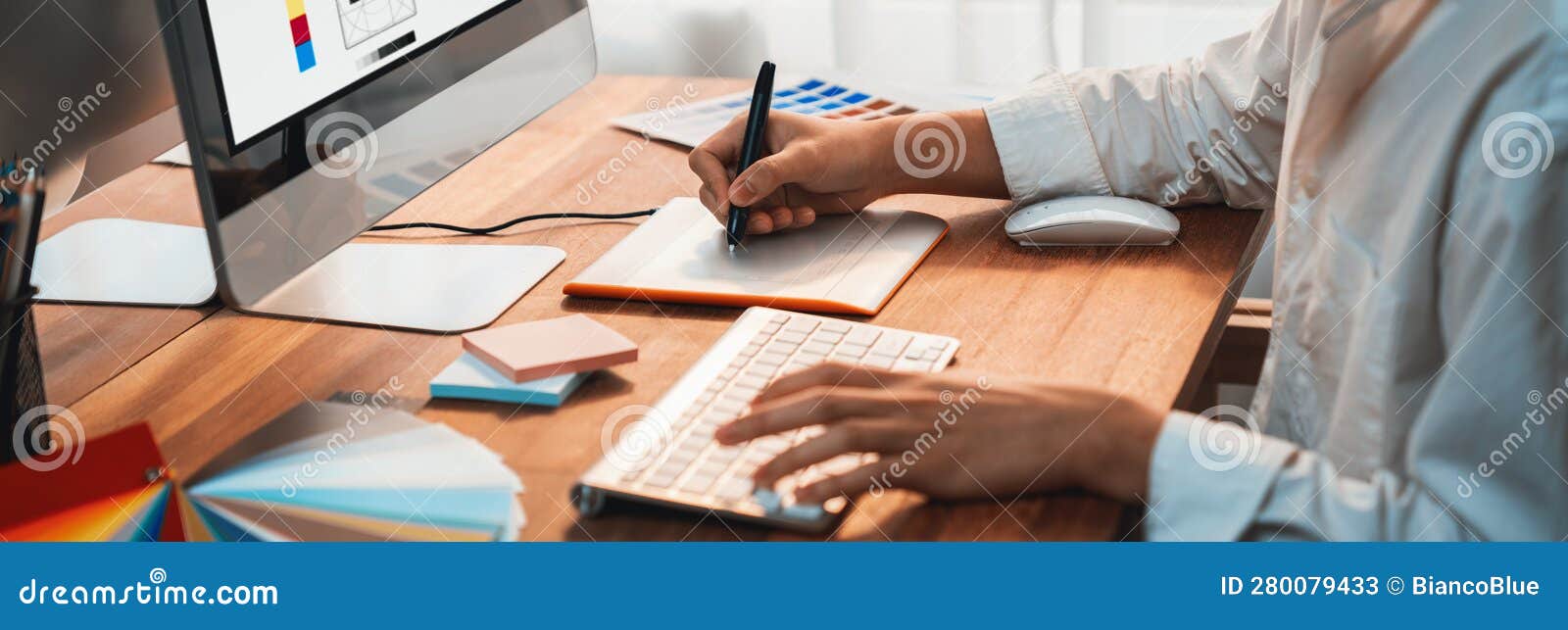 Graphic Designer Works on Computer Laptop with Digital Pen. Scrutinize ...