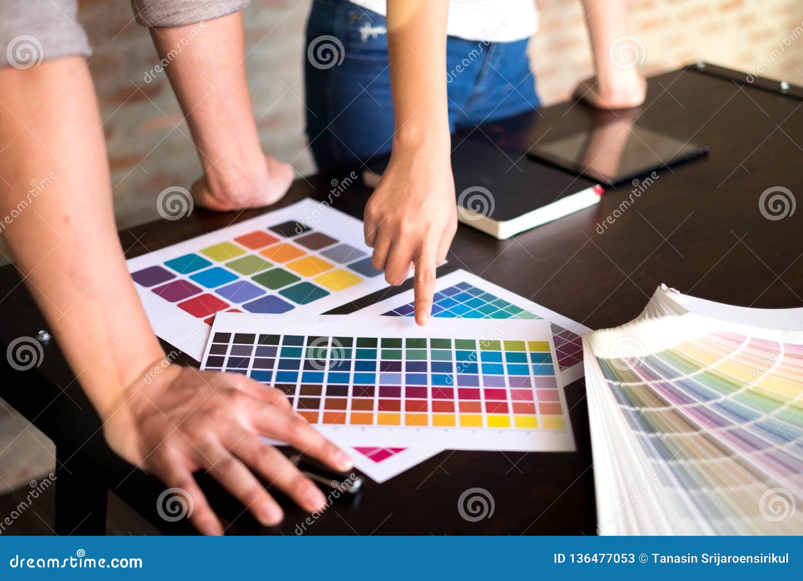 Graphic Designers Choose Colors from the Color Bands Samples for Design ...
