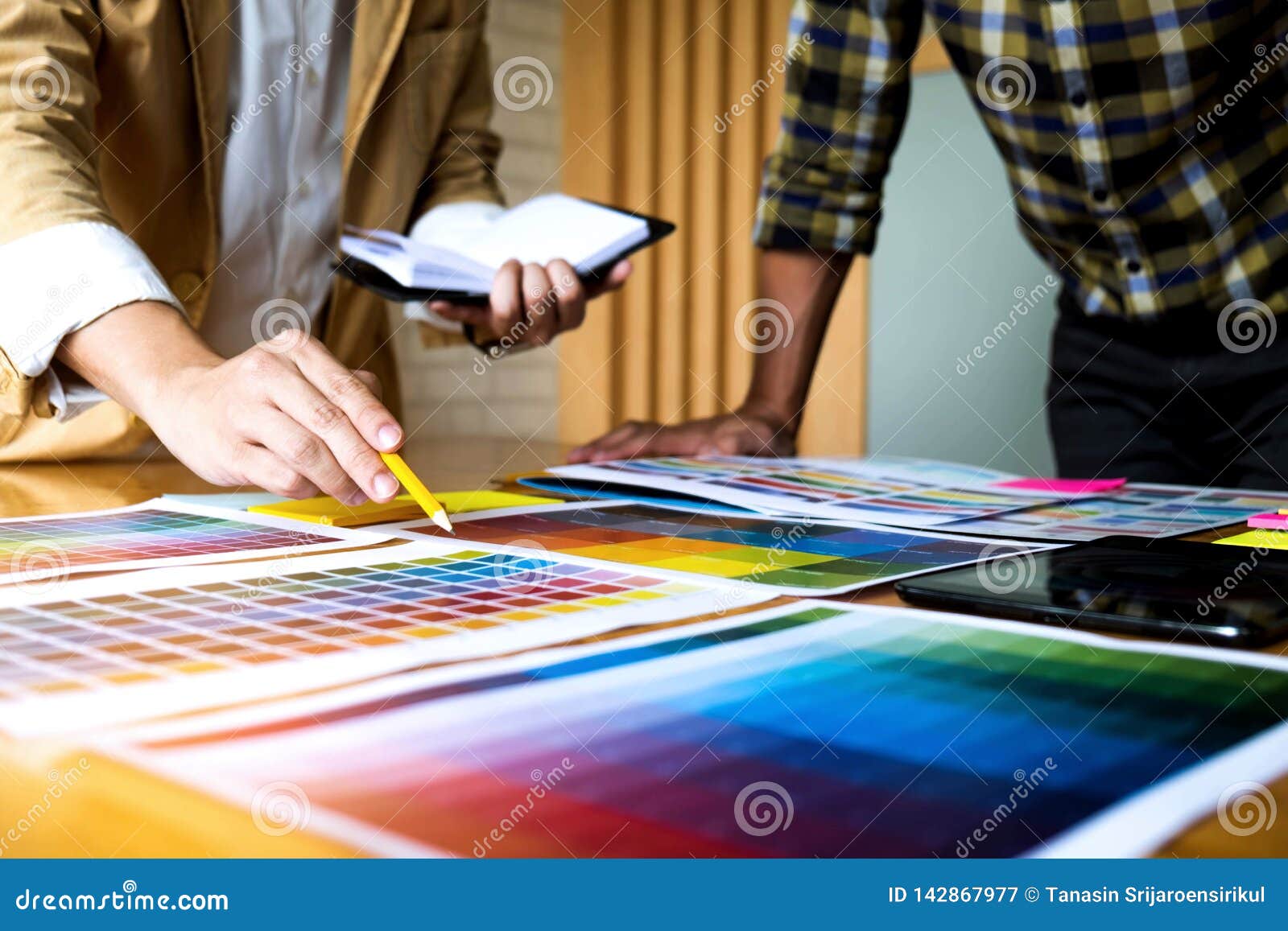 Graphic Designers Choose Colors from the Color Bands Samples for Design ...