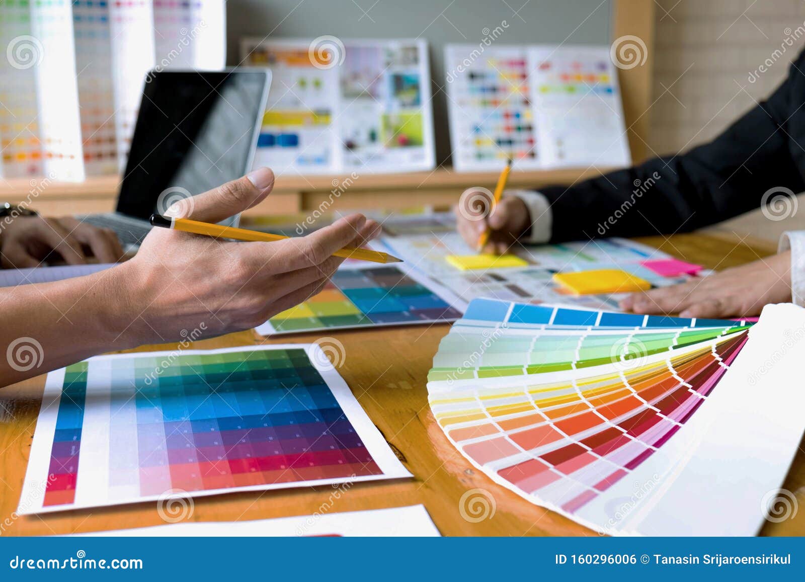 Graphic Designers Choose Colors from the Color Bands Samples for Design ...