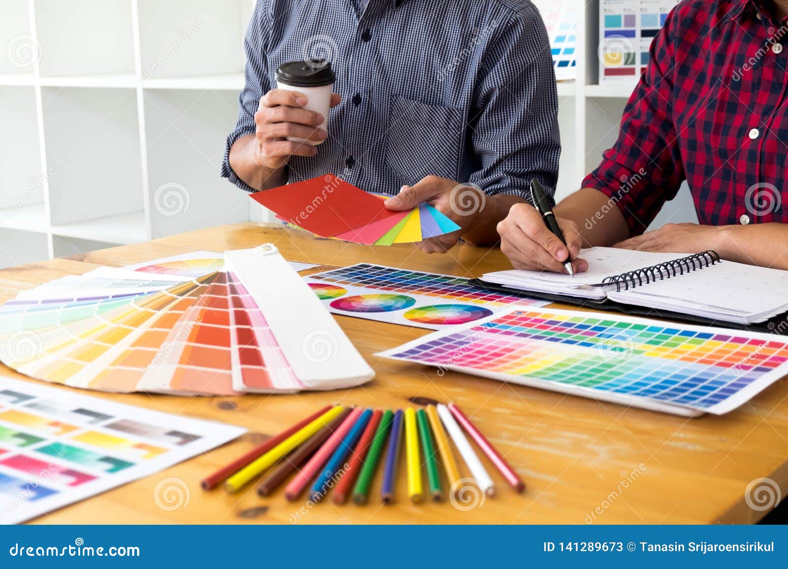 Graphic Designers Choose Colors from the Color Bands Samples for Design ...