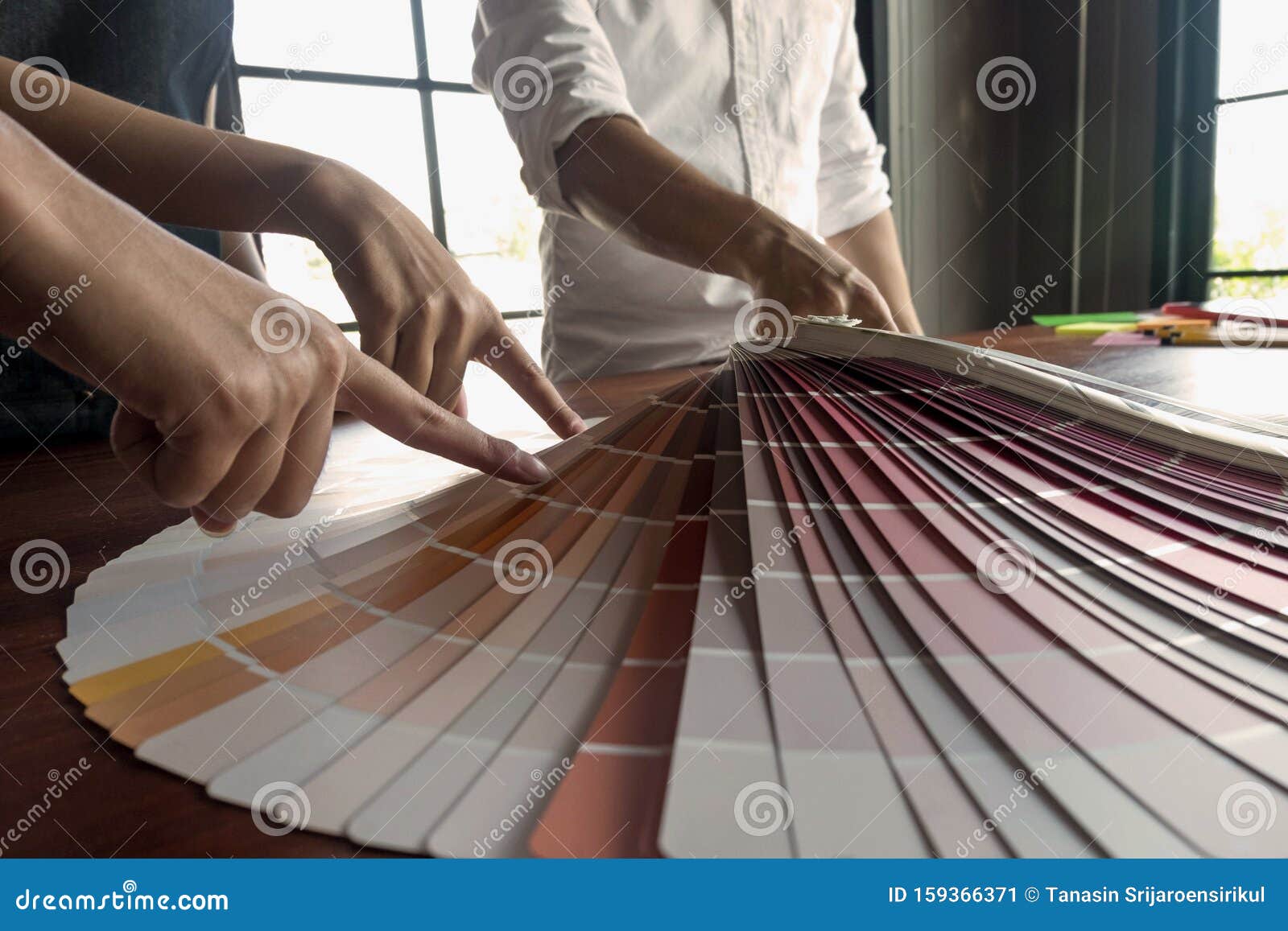 Graphic Designers Choose Colors from the Color Bands Samples for Design ...