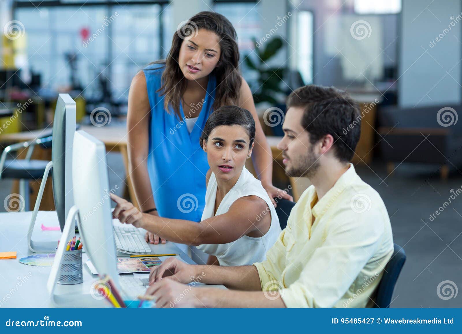 Graphic Designers Interacting while Working on Personal Computer Stock ...