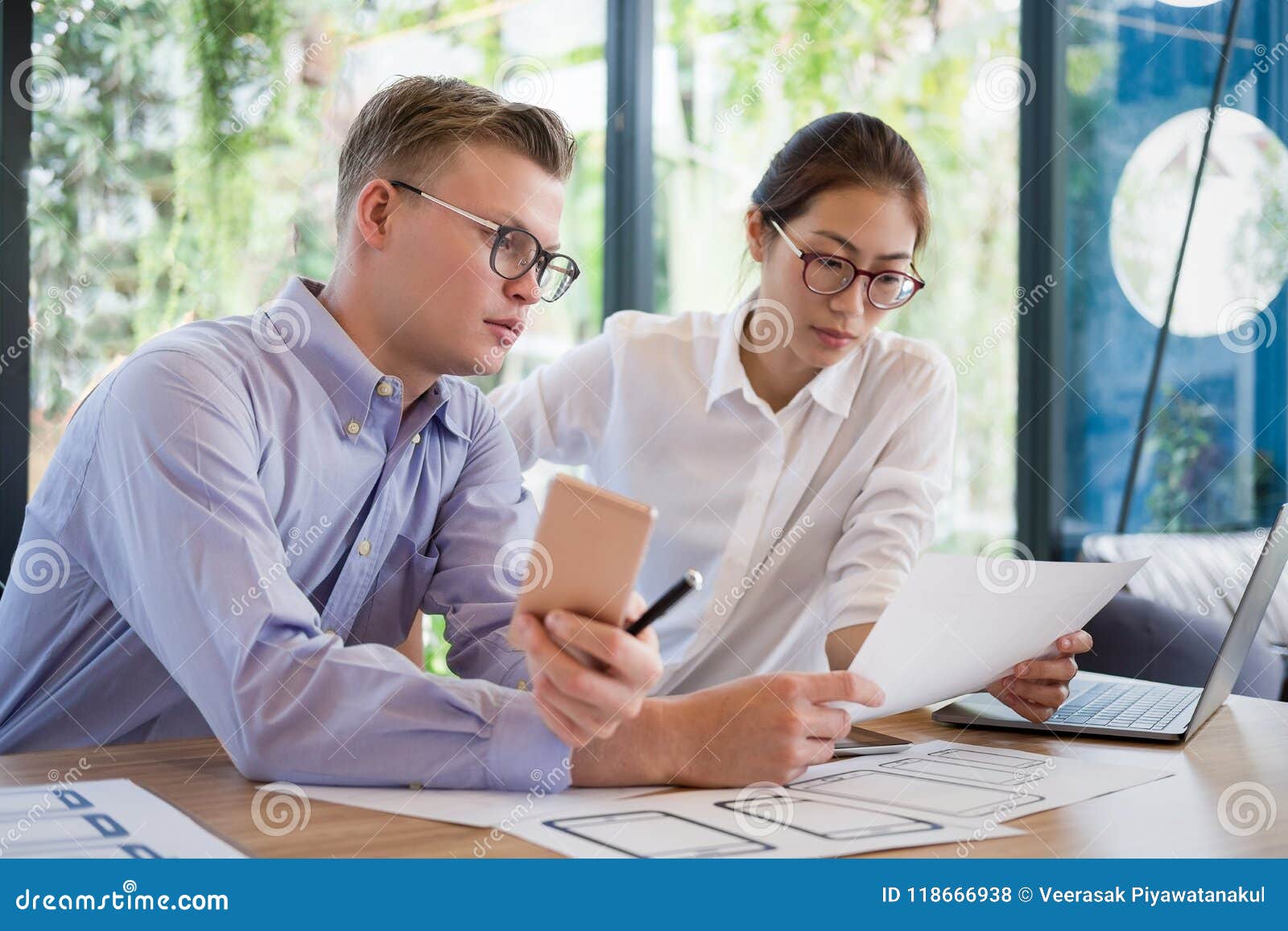 Graphic Designers Work Together with Computer Designing Application for ...