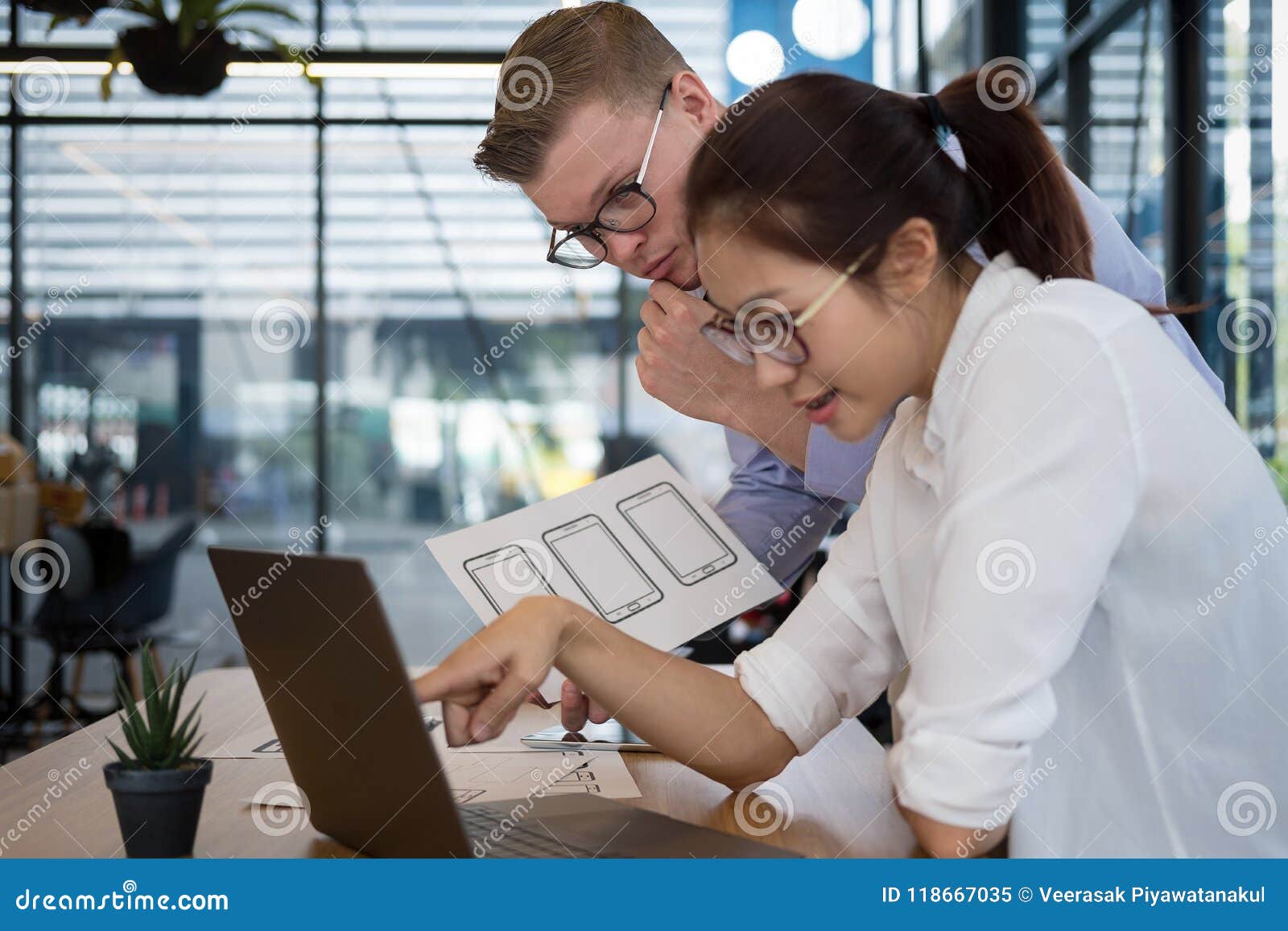 Graphic Designers Work Together with Computer Designing Application for ...