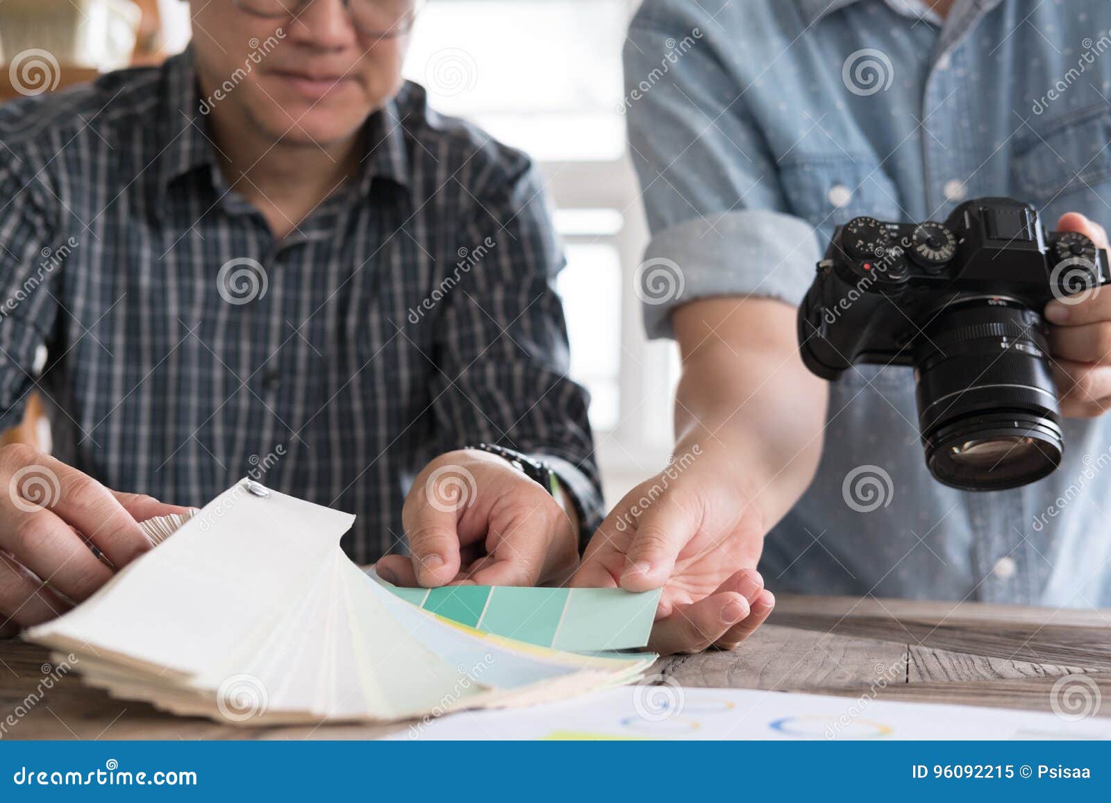 Graphic or Interior Designer Selecting a Colour from Color Swatch ...