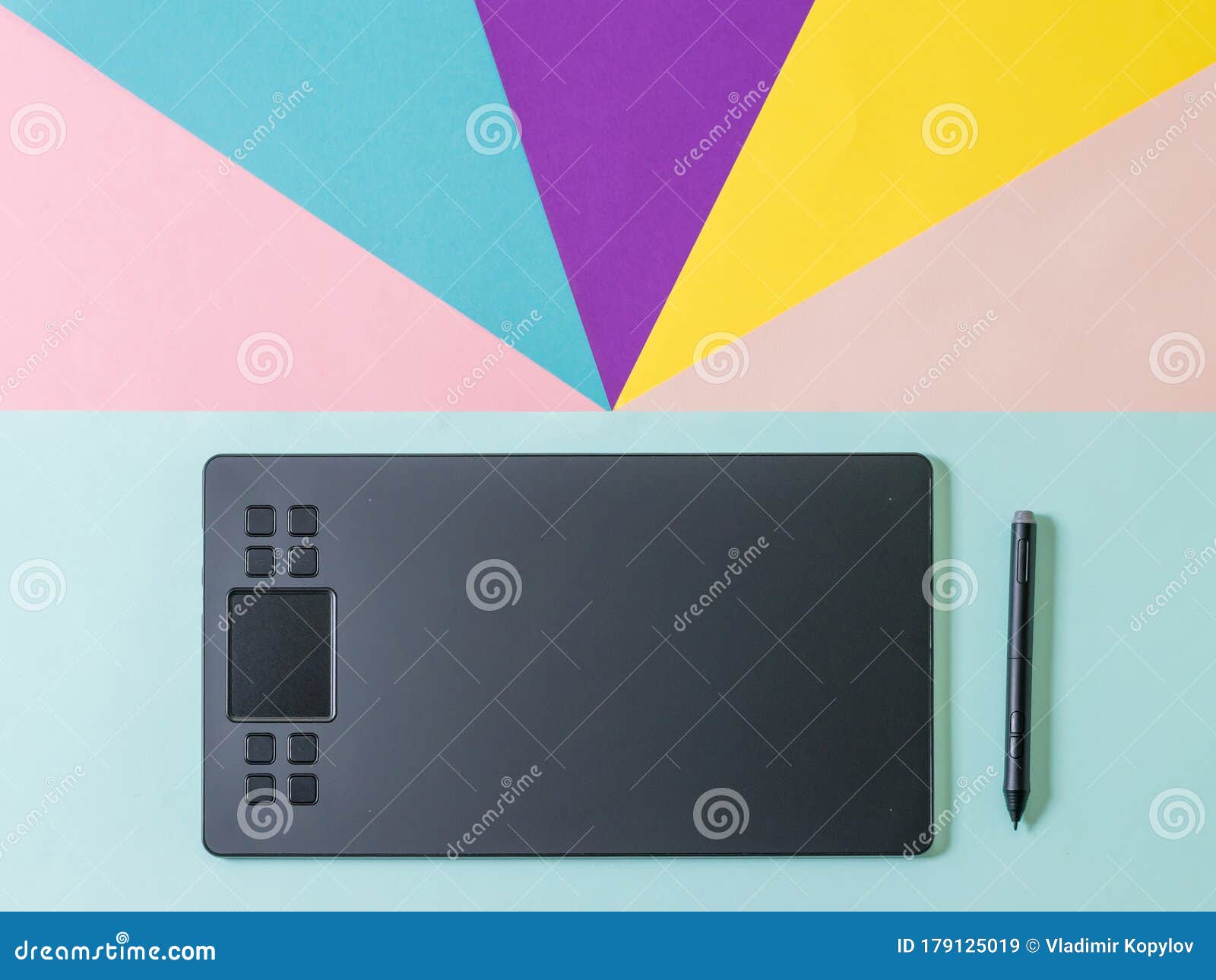 Graphic Tablet with a Pencil on a Background of Colored Paper. Stock ...
