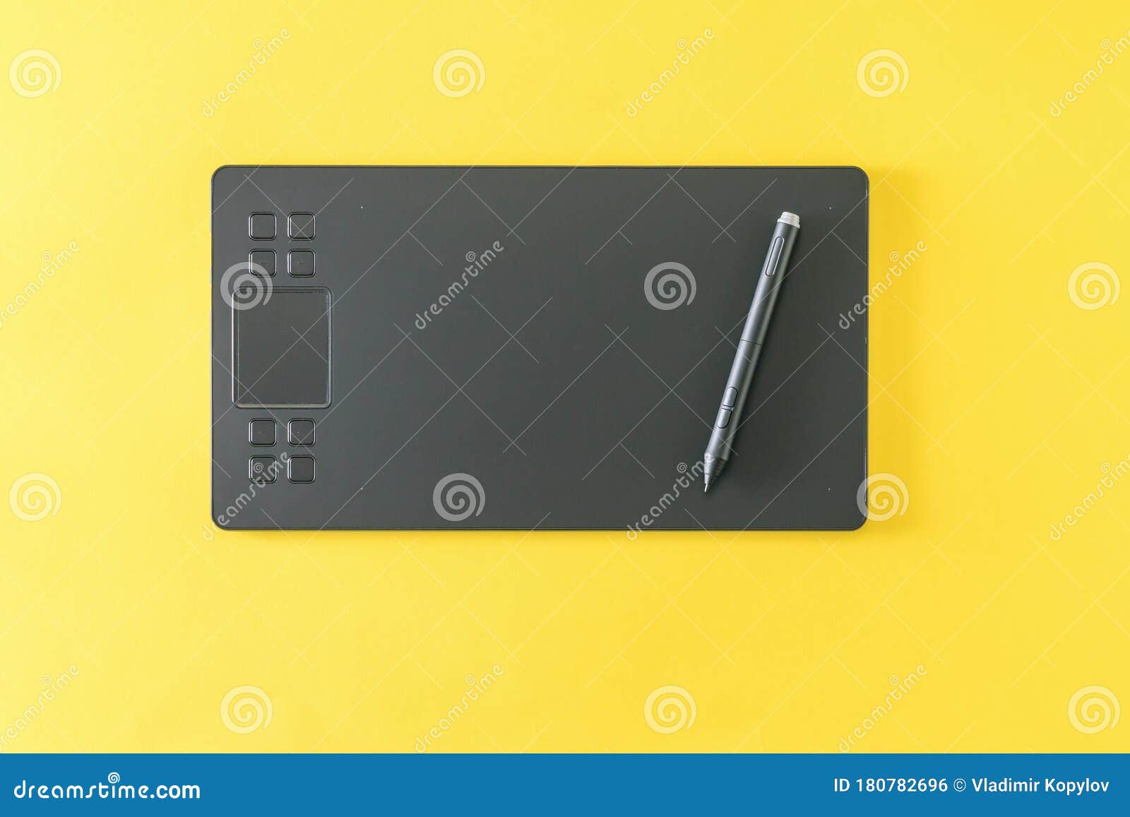 Graphic Tablet with a Pencil on a Bright Yellow Background. Stock Photo ...