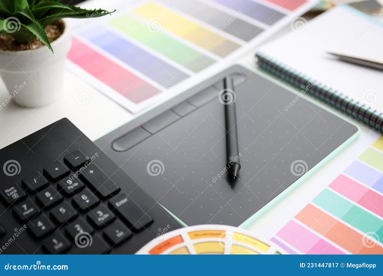 Graphic Tablet with Stylus and Color Palette on Table Stock Image ...