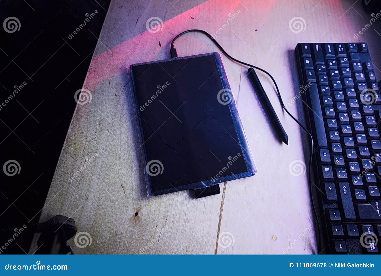 Graphic Tablet on the Table with Bright Red and Blue Lights Stock Photo ...