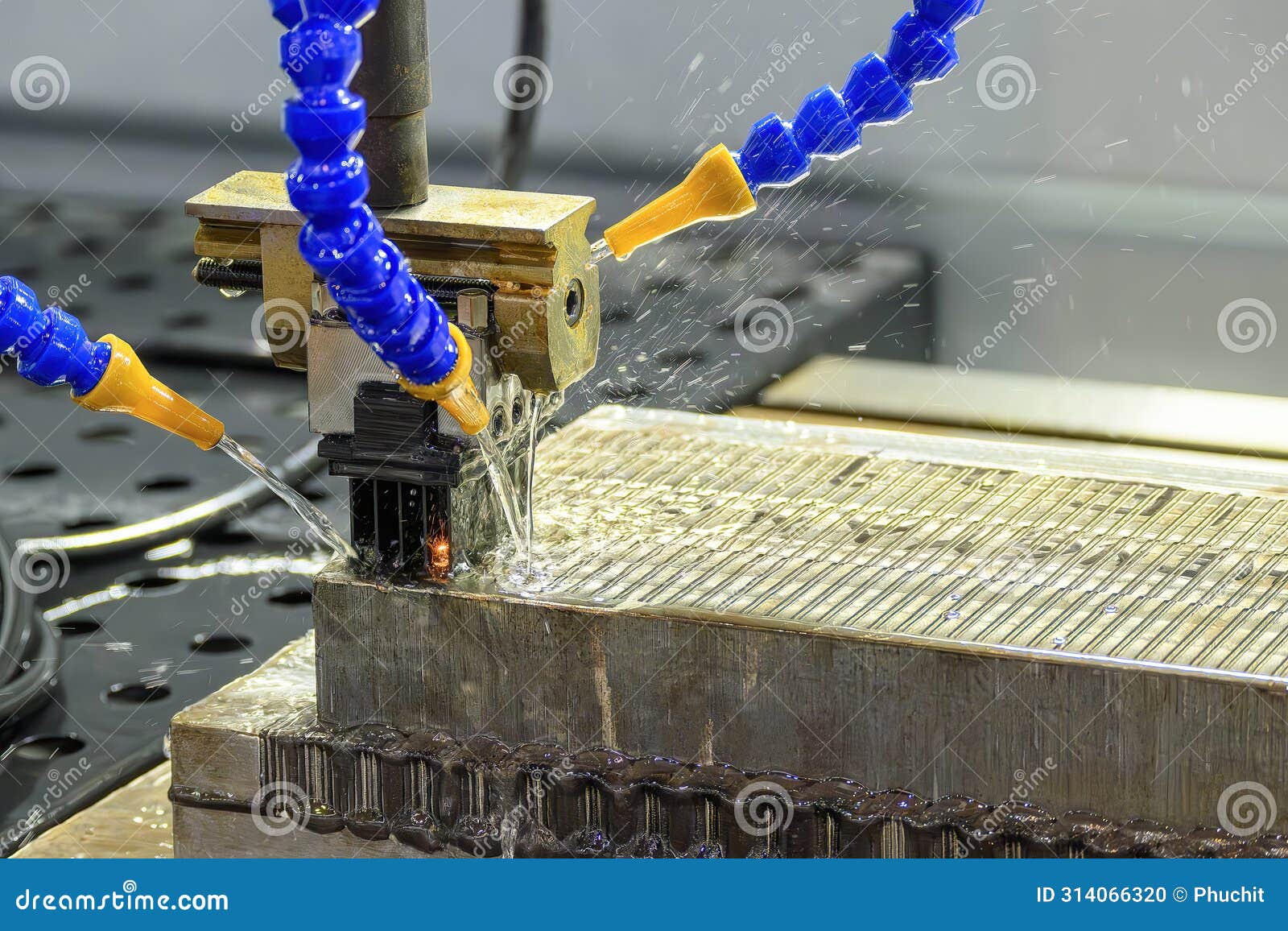 The Graphite Electrode Working on EDM Machine with Liquid Coolant ...