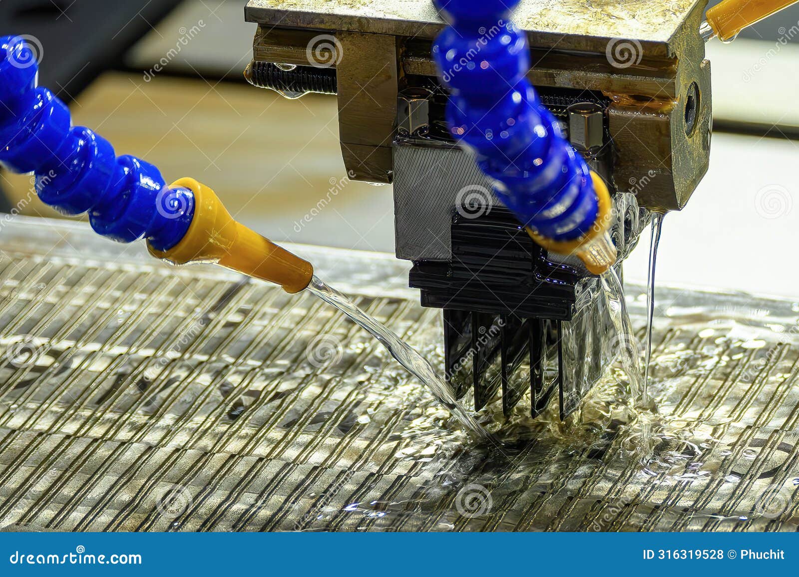 The Graphite Electrode Working on EDM Machine with Liquid Coolant ...