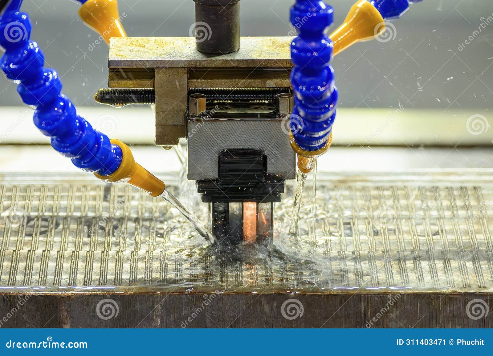 The Graphite Electrode Working on EDM Machine with Liquid Coolant ...