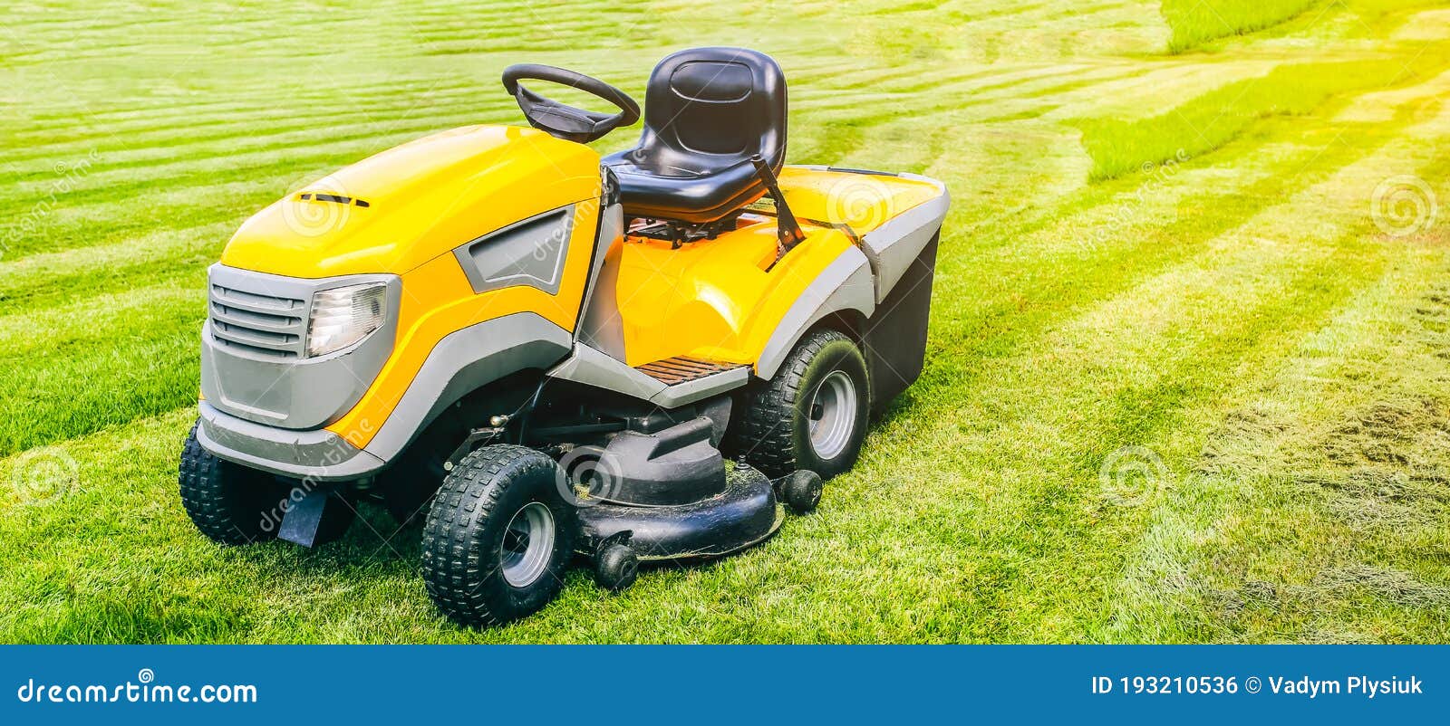 Grass Cutter in the Work. Machine for Cutting Lawn is Standing Outdoors ...