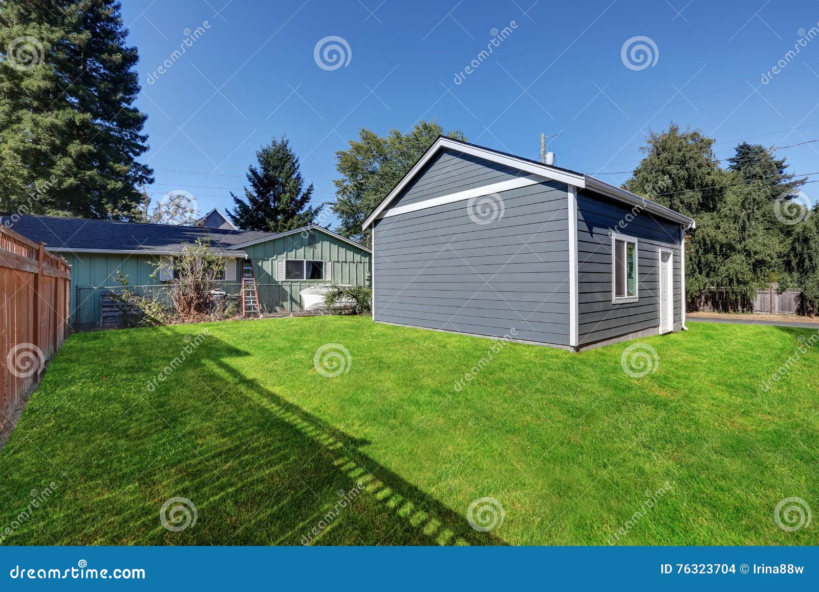 Grass Filled Back Yard with Detached Garage Stock Photo - Image of ...