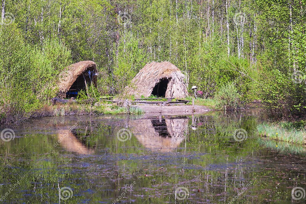 Grass Huts at the Lakeshore Stock Image - Image of prehistoric ...