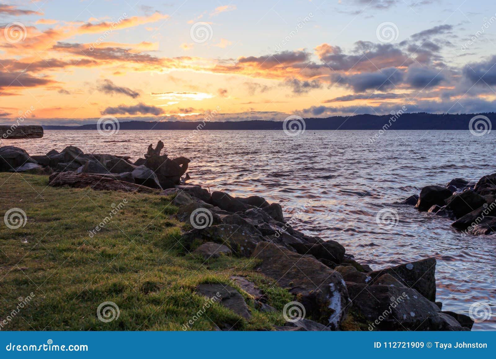 Grassy Hill in Front of Sunset Stock Image - Image of coastline ...