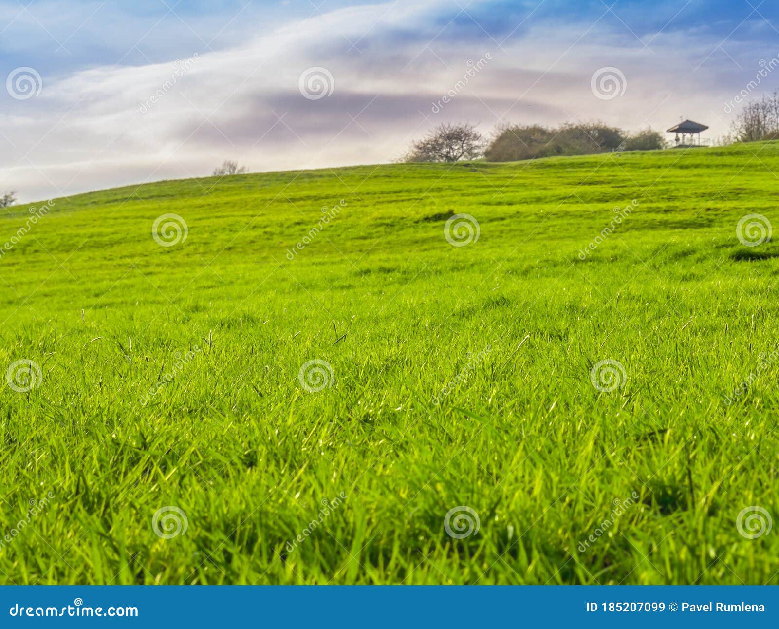 Grassy Hill with Lookout Tower - View from Level of Lawn Stock Image ...