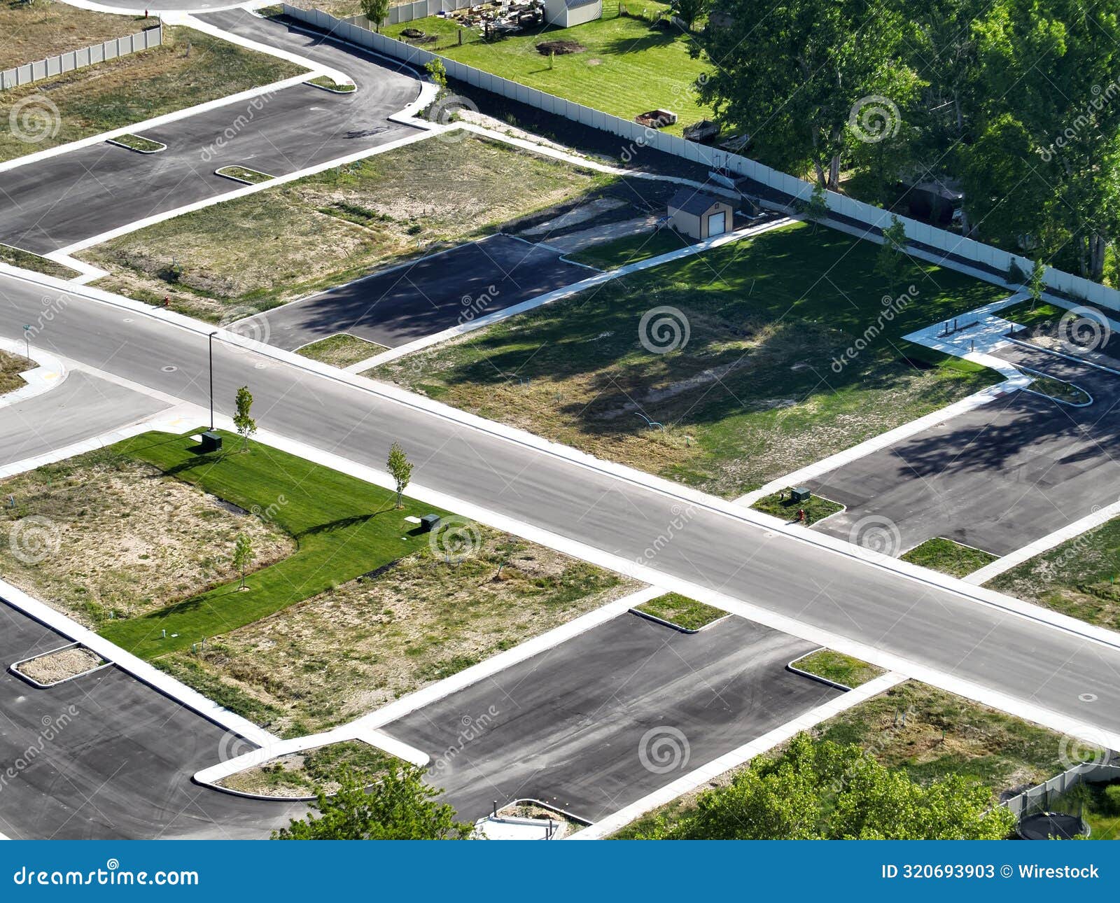 A Large Patch of Land Surrounded by Trees and Grass in the Middle of a ...