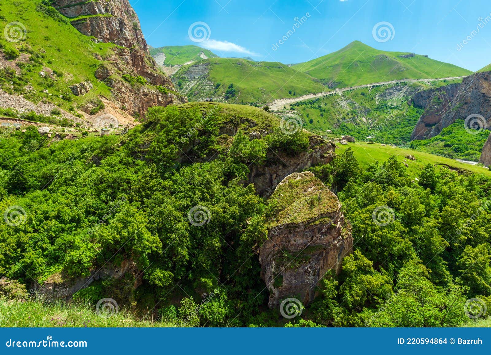 Grassy rocks and sunny sky stock photo. Image of rock - 220594864