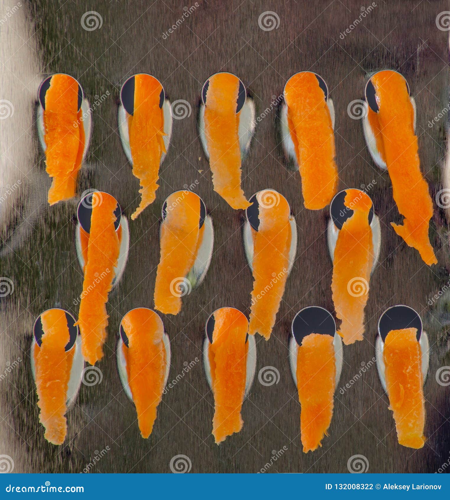 Grated Carrots. the Process of Grinding Carrots on a Grater Stock Photo ...