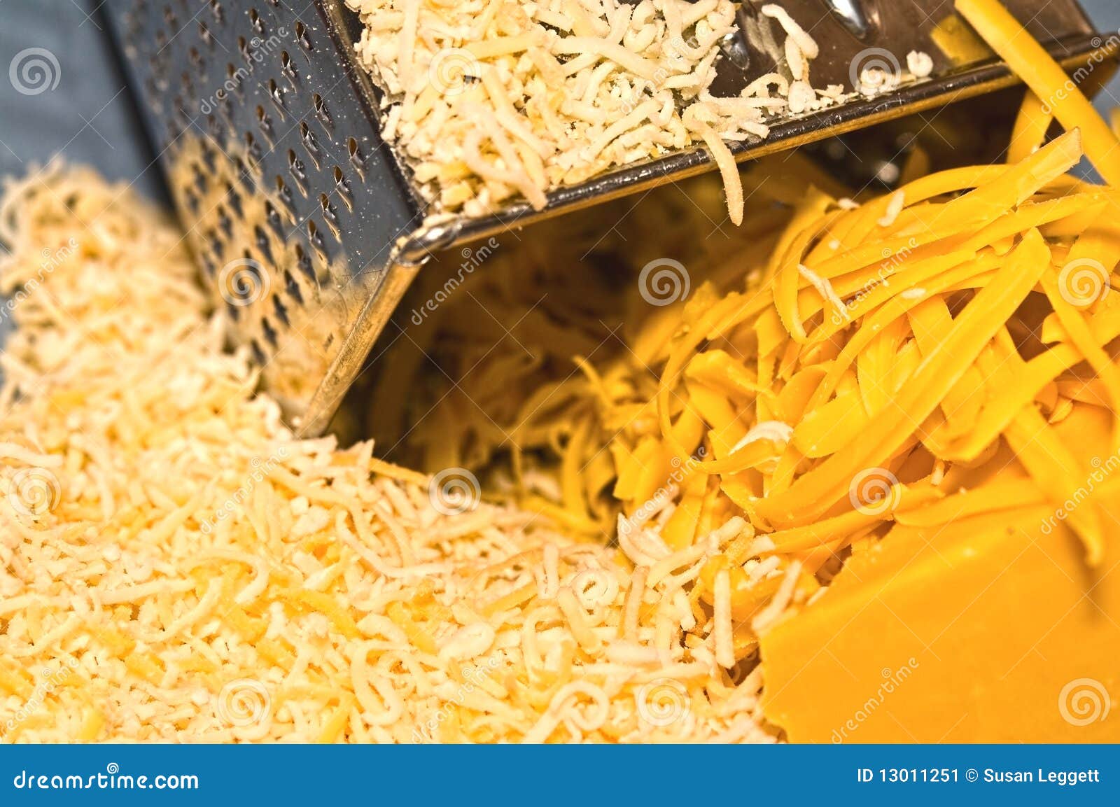 Grated Cheese Closeup stock image. Image of cheese, grate - 13011251
