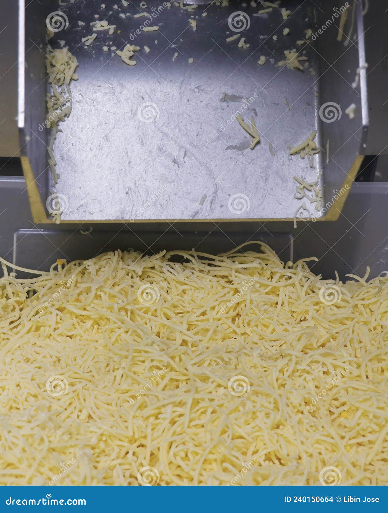 Grated Cheese Making with Electric Grater Machine Stock Photo - Image ...