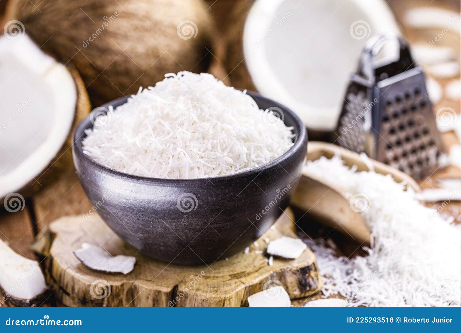 Grated Coconut Inside a Clay Bowl, with Coconut and Coconut Pieces in ...