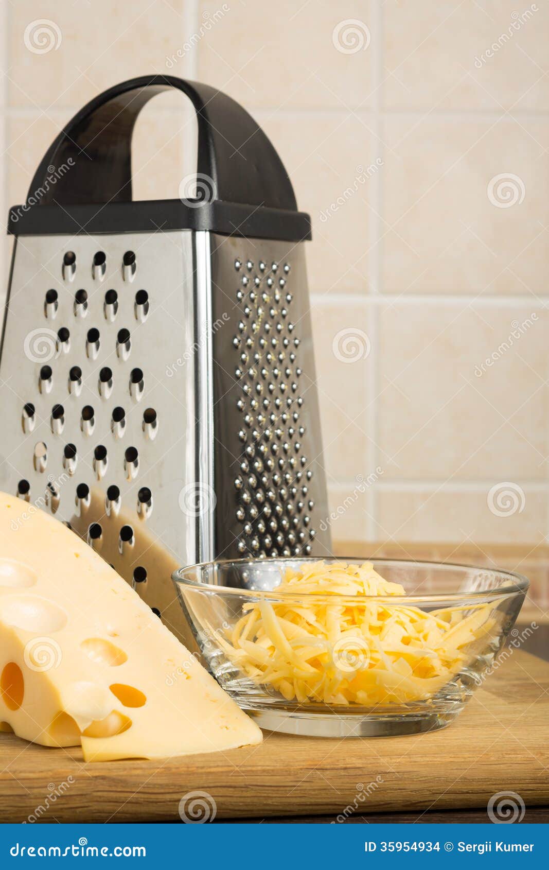 Grated Yellow Cheese with Grater at the Kitchen Stock Photo - Image of ...