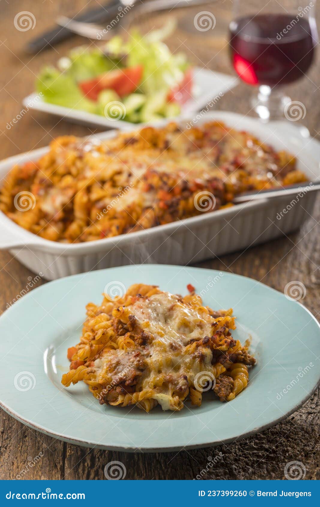Gratinated pasta on wood stock photo. Image of meat - 237399260