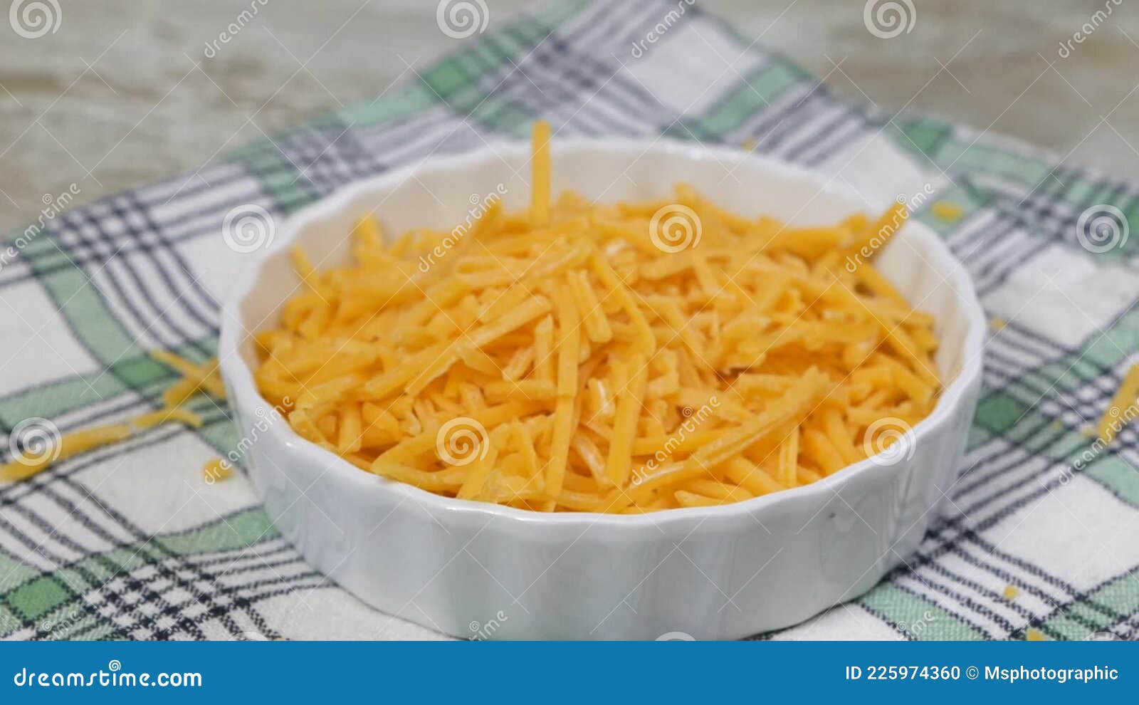 Grating Cheddar Cheese Falling into a Bowl Stock Footage - Video of ...