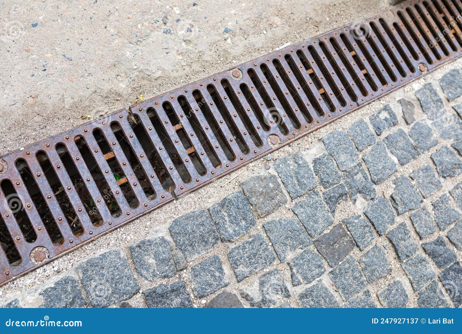 Grating of Drainage System Rainwater in the Park at the Sidewalk from a ...