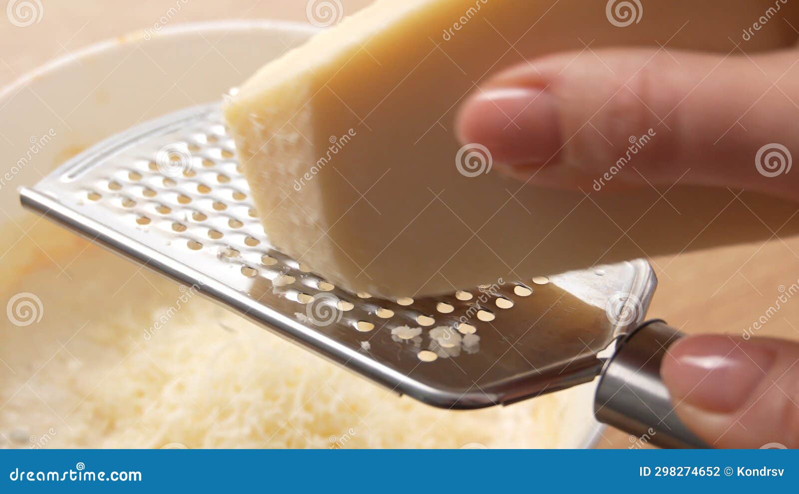 Grating Fresh Cheese Over Bowl Close-up. Stock Photo - Image of ...