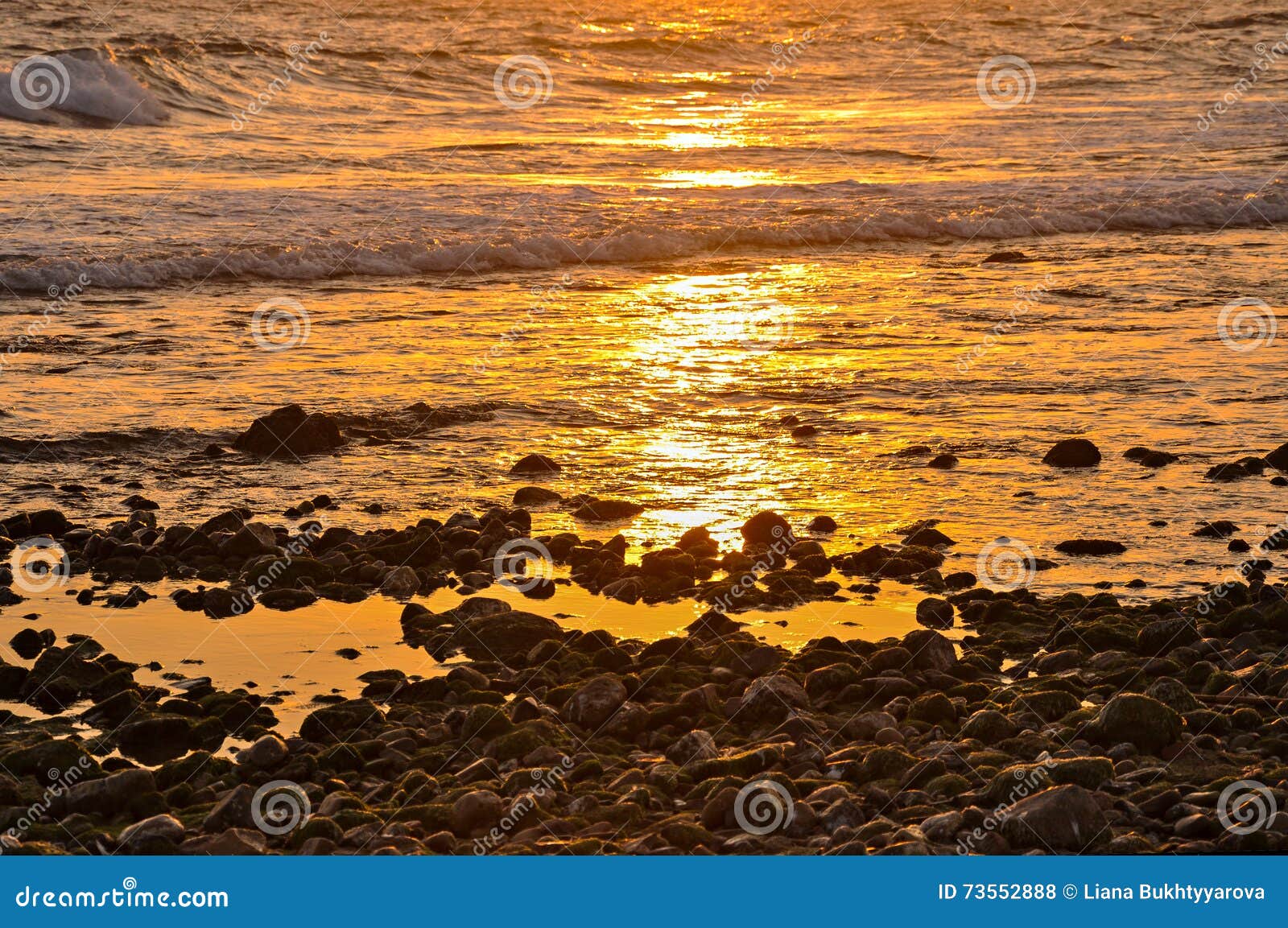 Gravel Beach in Amber Sunlight. Stock Photo - Image of beach, ripple ...