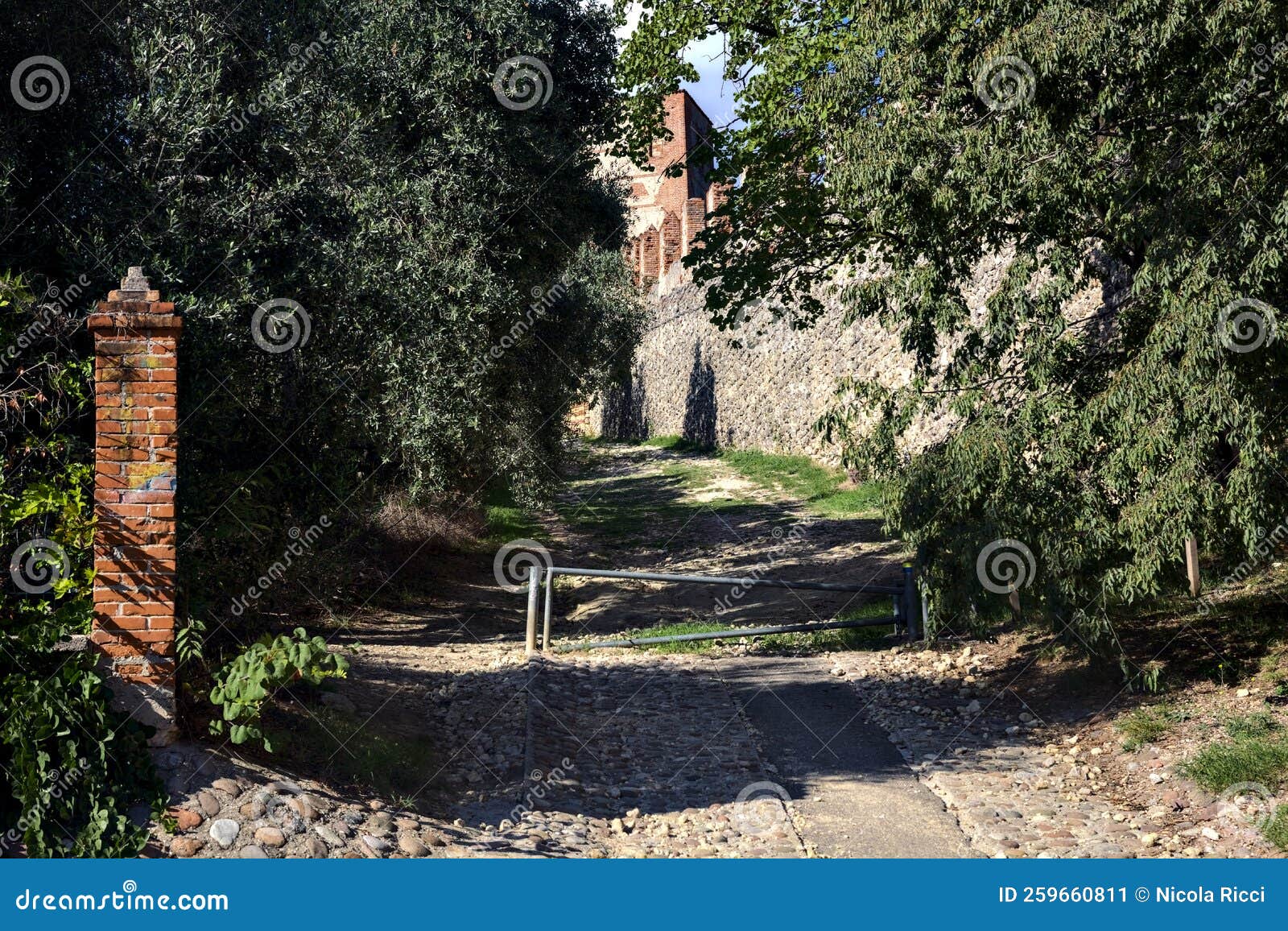 Gravel Path on a Hill Bordered by a Fortification and an Olive Tree ...