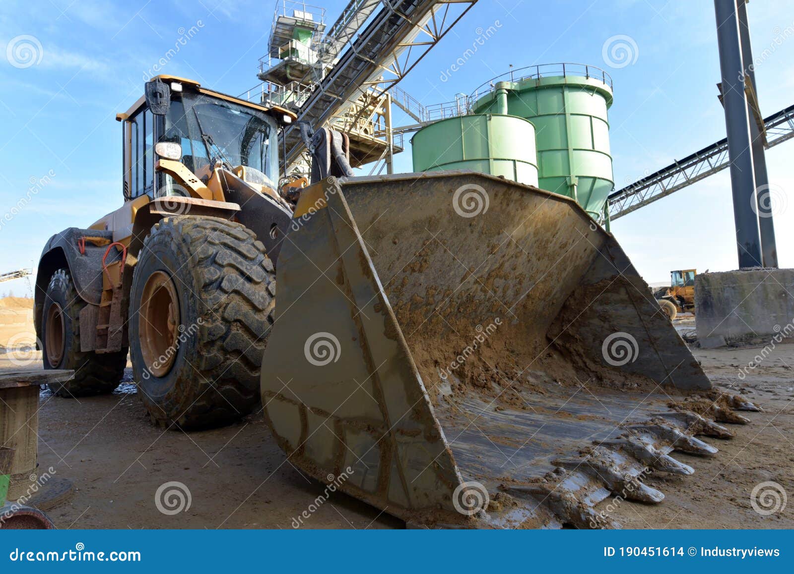 Gravel Pit: Building and Wheel Loader Loading Gravel Onto a Truck Stock ...