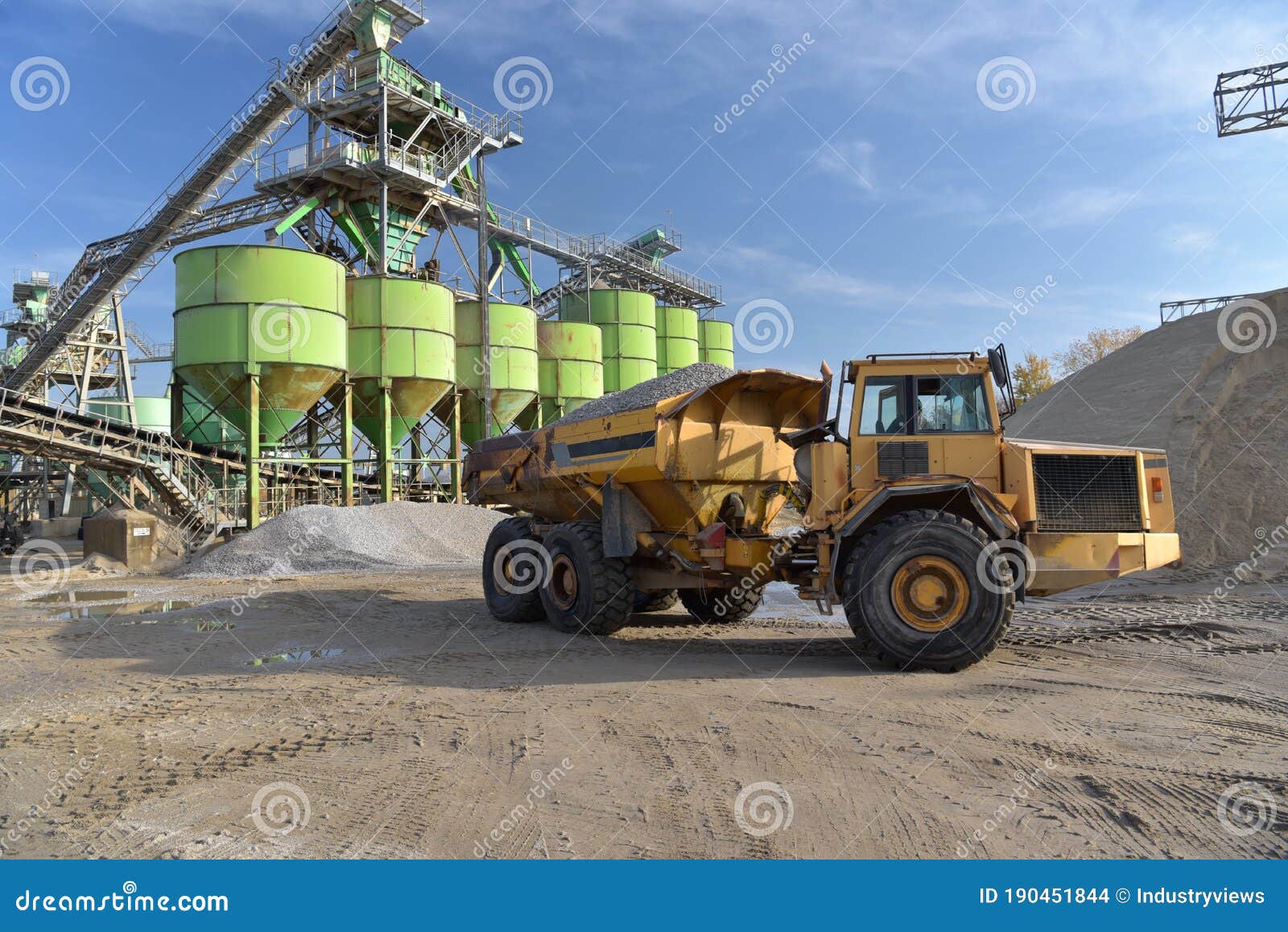 Gravel Pit: Building and Wheel Loader Loading Gravel Onto a Truck Stock ...