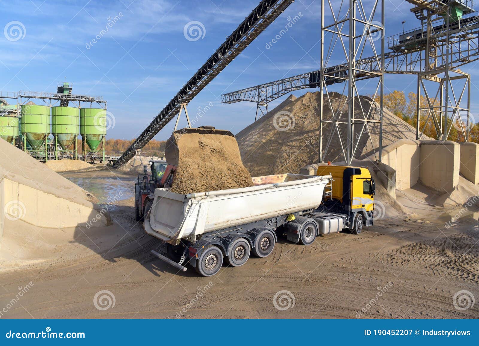 Gravel Pit: Building and Wheel Loader Loading Gravel Onto a Truck Stock ...