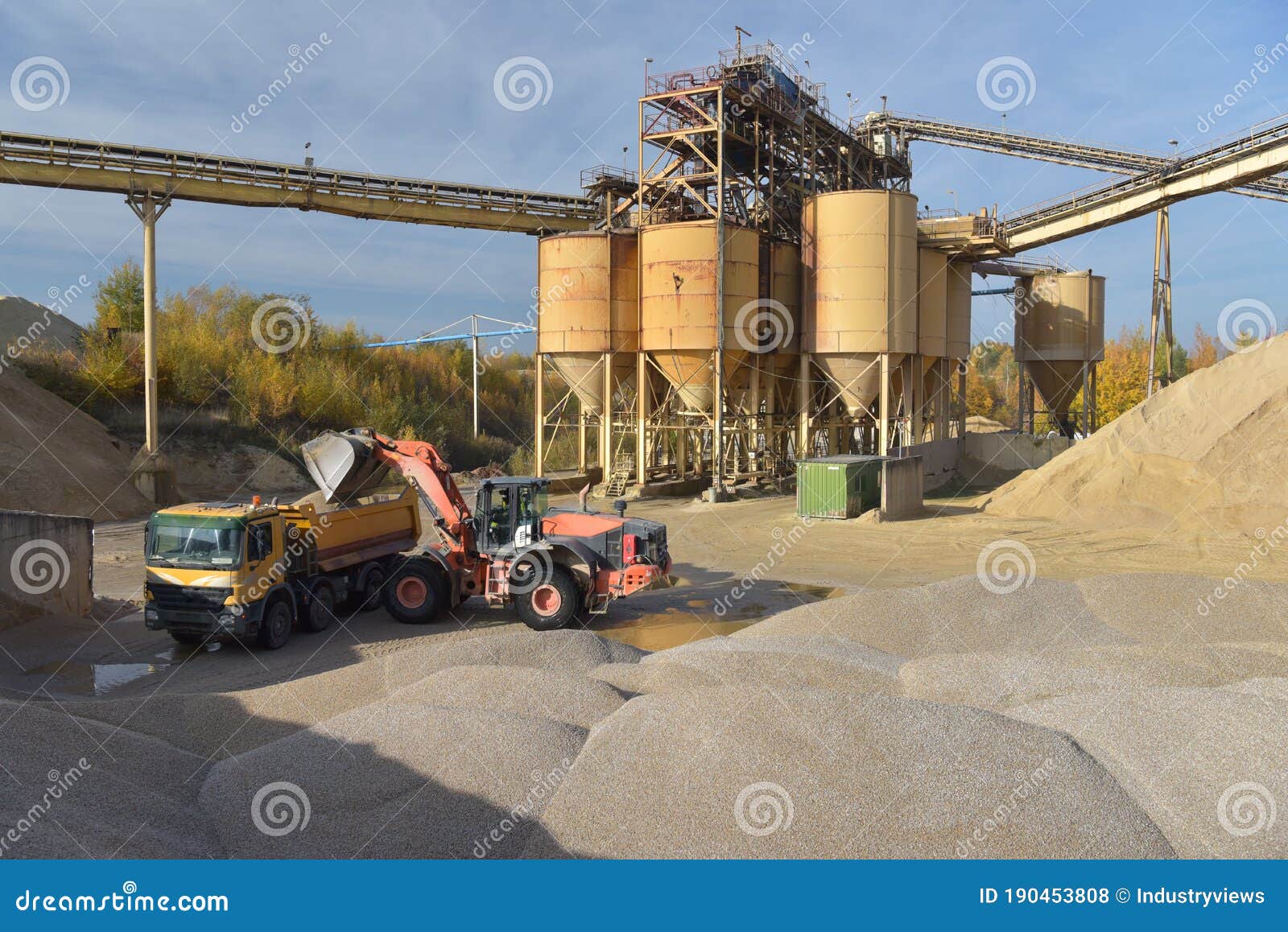Gravel Pit: Building and Wheel Loader Loading Gravel Onto a Truck Stock ...