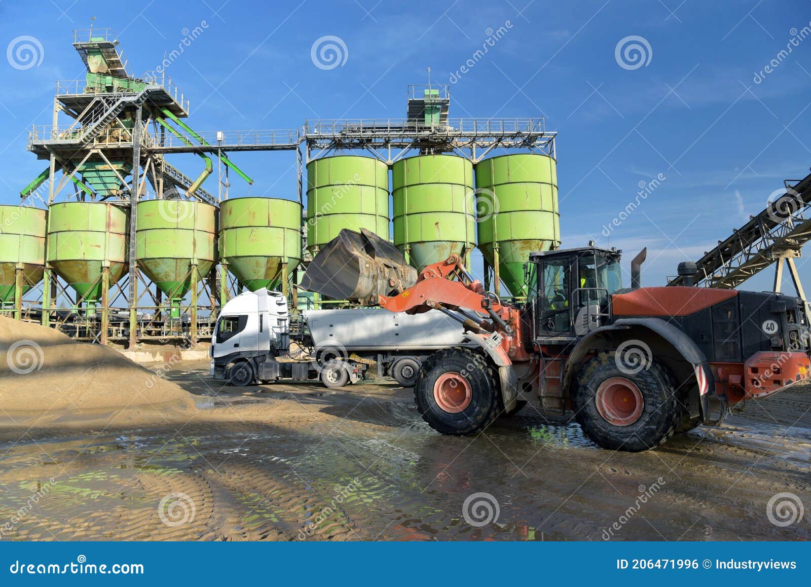 Gravel Pit: Building and Wheel Loader Loading Gravel Onto a Truck Stock ...