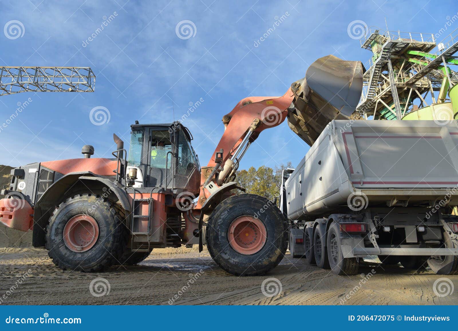 Gravel Pit: Building and Wheel Loader Loading Gravel Onto a Truck Stock ...