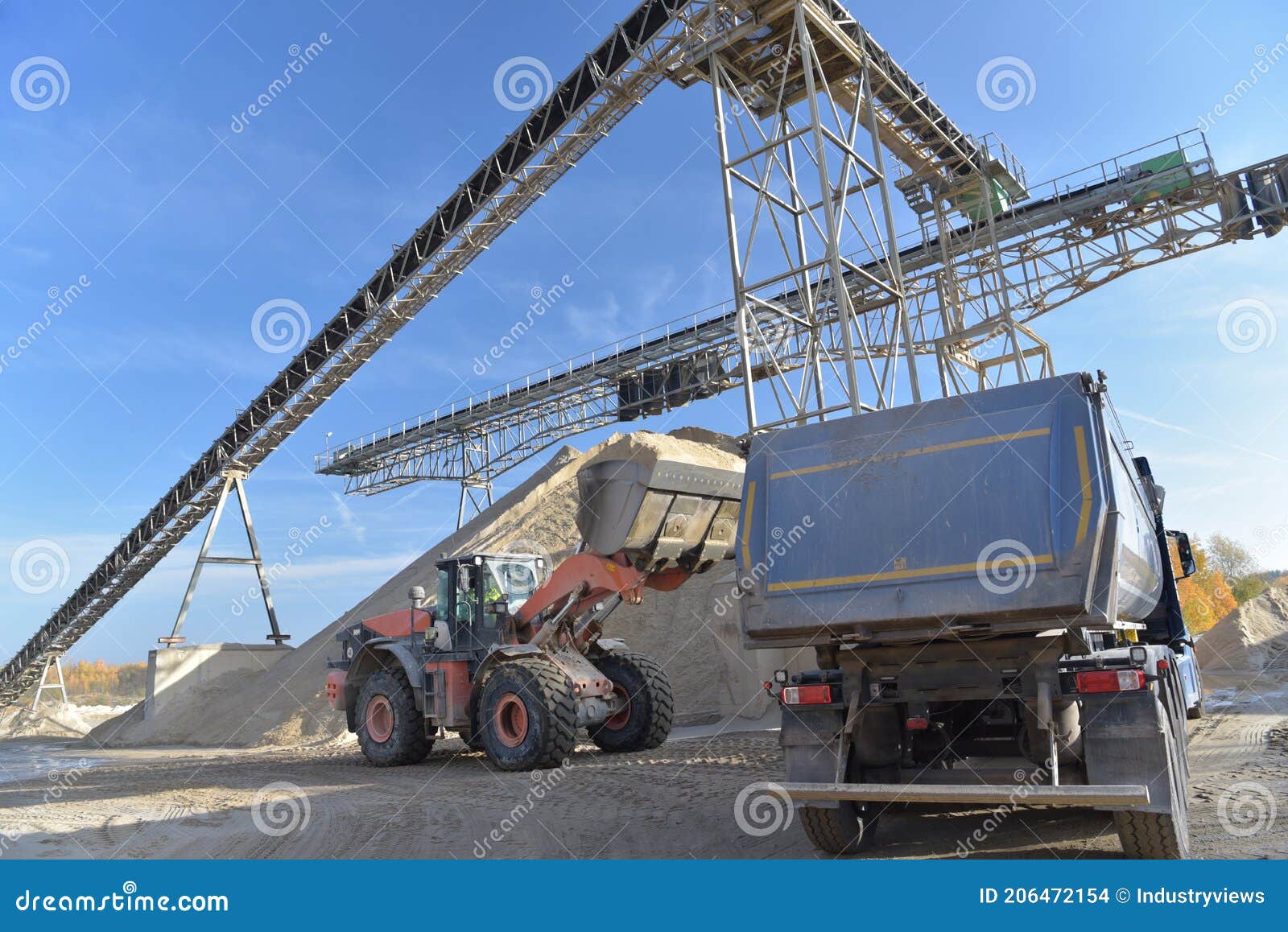 Gravel Pit: Building and Wheel Loader Loading Gravel Onto a Truck Stock ...