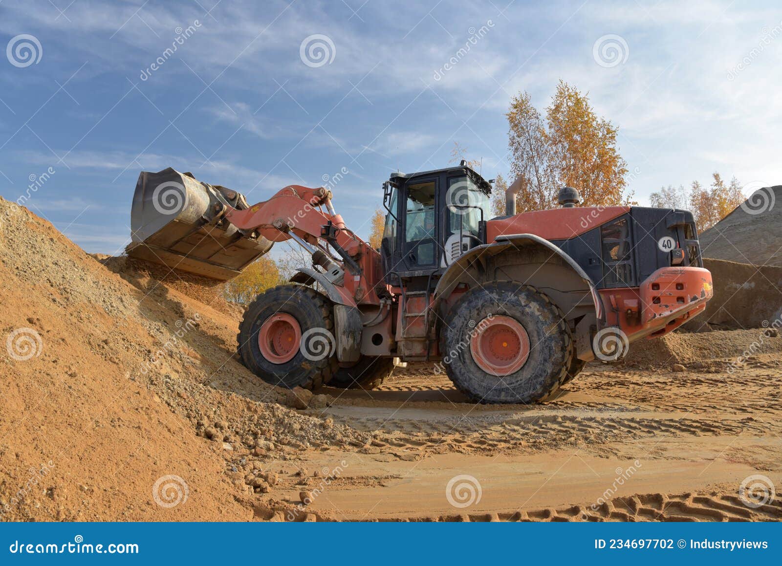 Gravel Pit: Building and Wheel Loader Loading Gravel Onto a Truck Stock ...